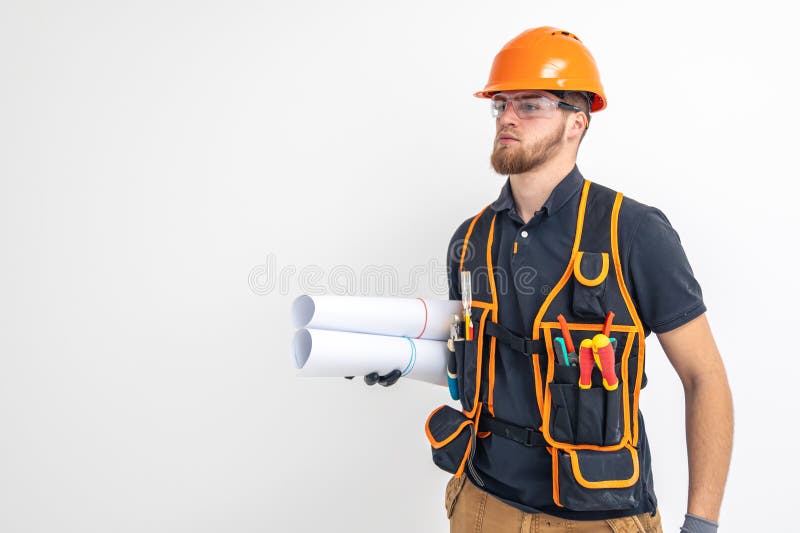 Male Builder. Electrical Engineer in Overalls and Helmet Holds ...
