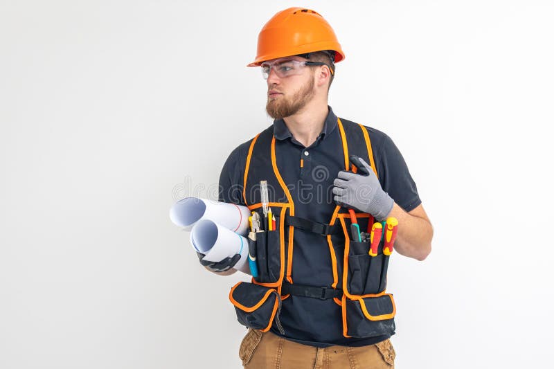 Male Builder. Electrical Engineer in Overalls and Helmet Holds ...