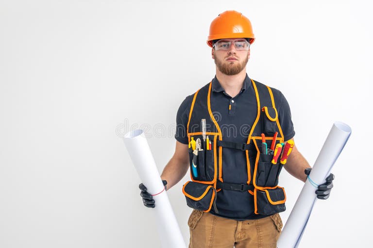 Male Builder. Electrical Engineer in Overalls and Helmet Holds ...