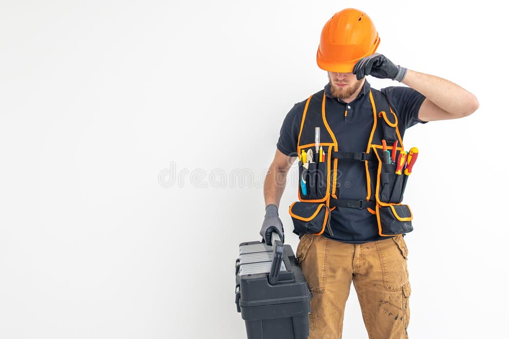 Male Builder. Electrical Engineer in Overalls and Helmet Holds Toolbox ...