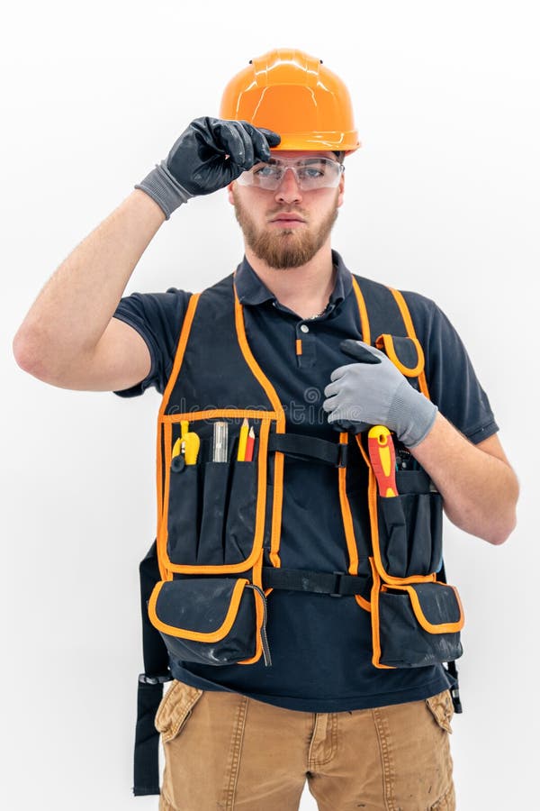 Male Builder. Electrical Engineer in Overalls and Helmet on Light ...