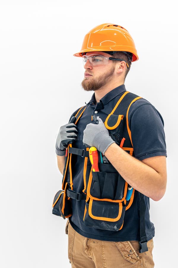 Male Builder. Electrical Engineer in Overalls and Helmet on Light ...
