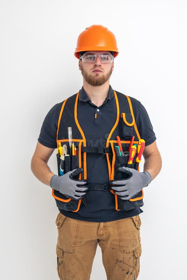 Male Builder. Electrical Engineer in Overalls and Helmet on Light ...