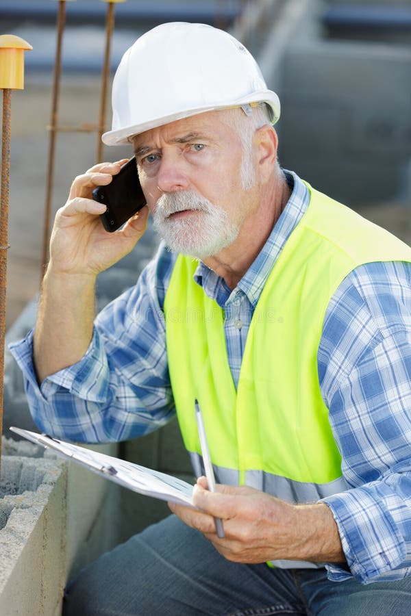 Male Builder Foreman Architect on Building Site Using Phone Stock Photo ...