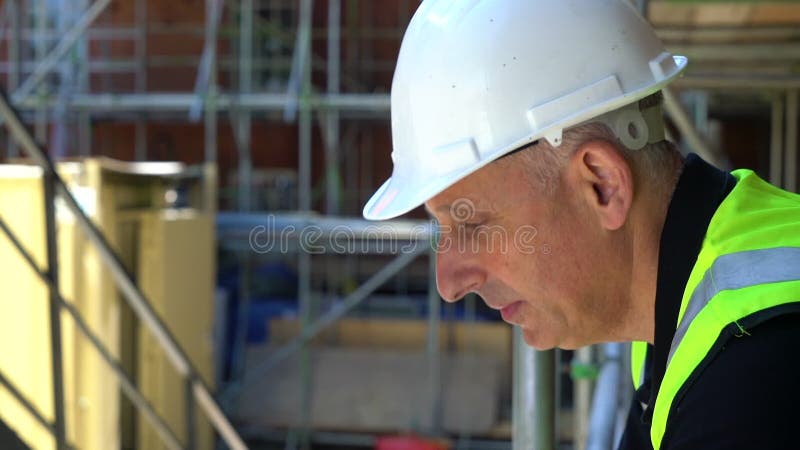 Male Builder Foreman, Worker or Architect Working on Construction ...