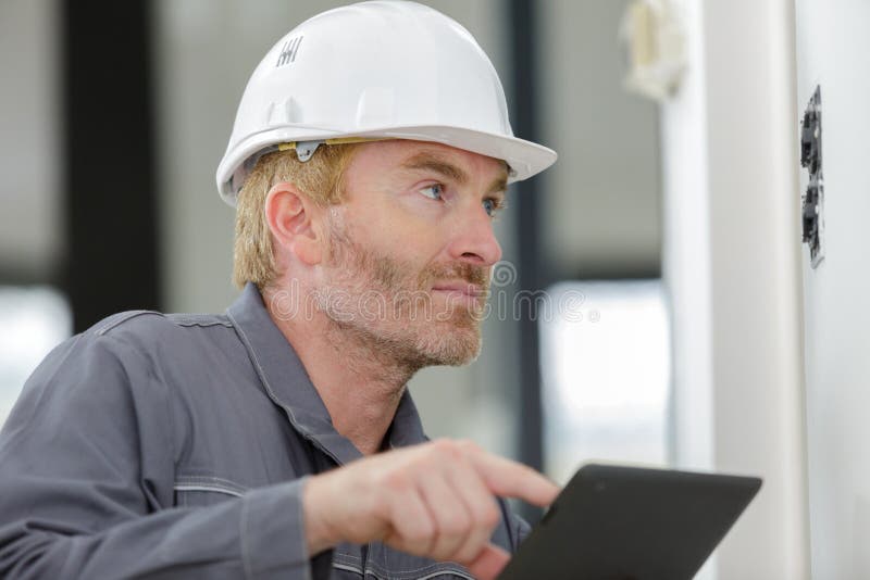 Male Builder in Hard Hat with Clipboard Stock Photo - Image of contract ...