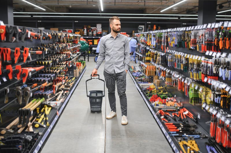 Male Builder in a Hardware Store Stock Photo - Image of choose, person ...