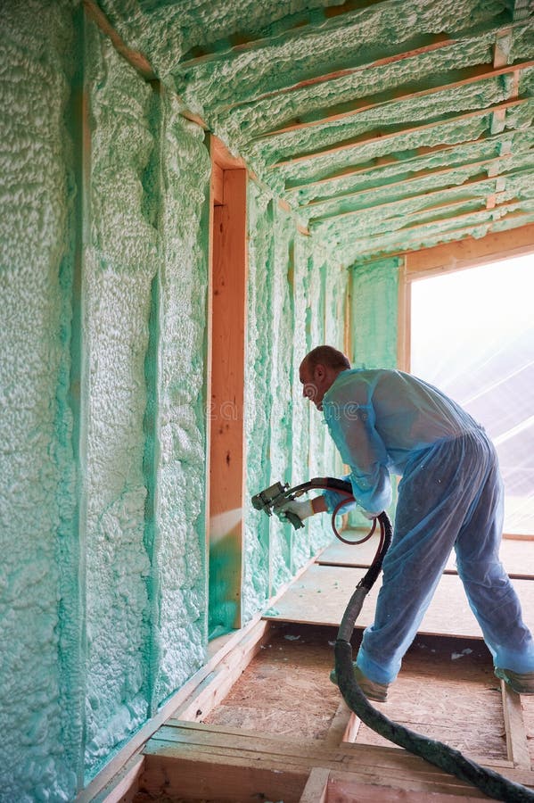 Worker Spraying Polyurethane Foam for Insulating Wooden Frame House ...