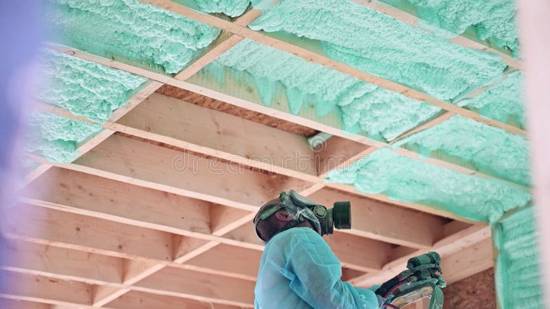 Worker Spraying Polyurethane Foam for Insulating Wooden Frame House ...