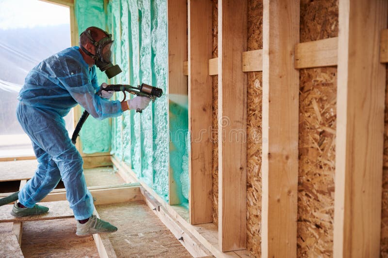 Worker Spraying Polyurethane Foam for Insulating Wooden Frame House ...