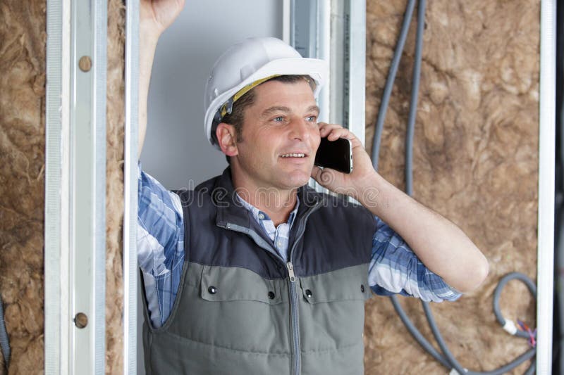 Male Builder on Phone Talking To Client Stock Image - Image of estate ...