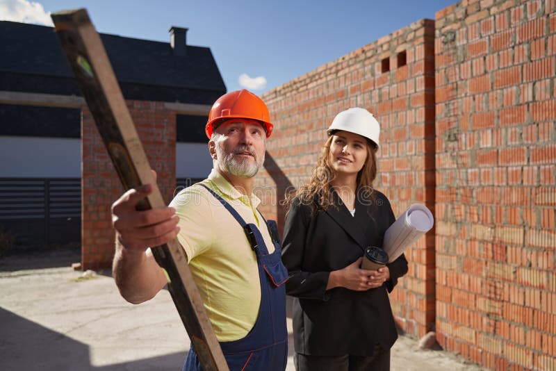 Male Builder with Pointing with Bubble Level Stock Image - Image of ...