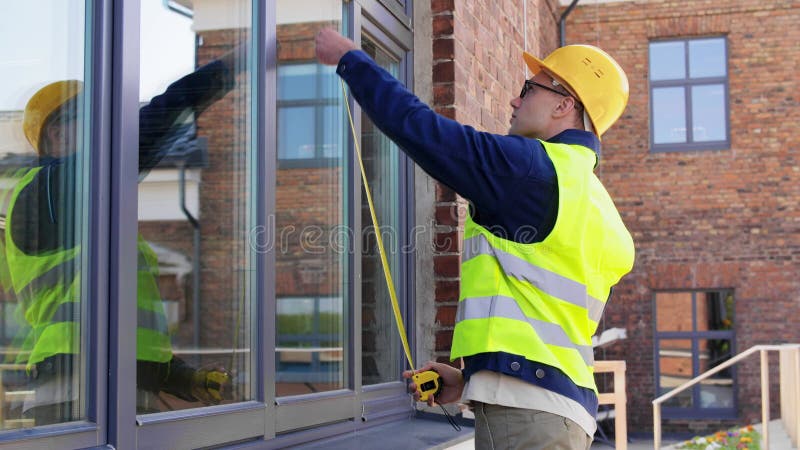 Male Builder with Ruler Measuring Window Stock Video - Video of slowmo ...