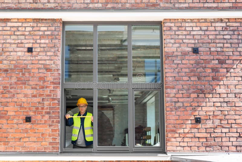 Male Builder with Ruler Measuring Window Stock Photo - Image of ...