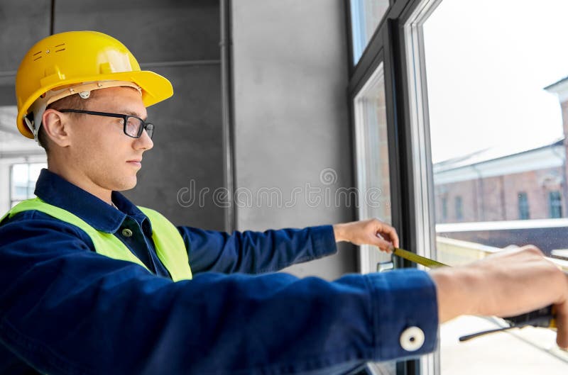 Male Builder with Ruler Measuring Window Stock Photo - Image of ...