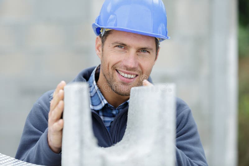 Male Builder Stood by Concrete Block Stock Image - Image of work ...