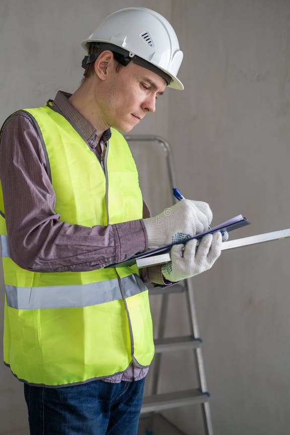 Male Builder Taking Notes on Construction Site Stock Image - Image of ...