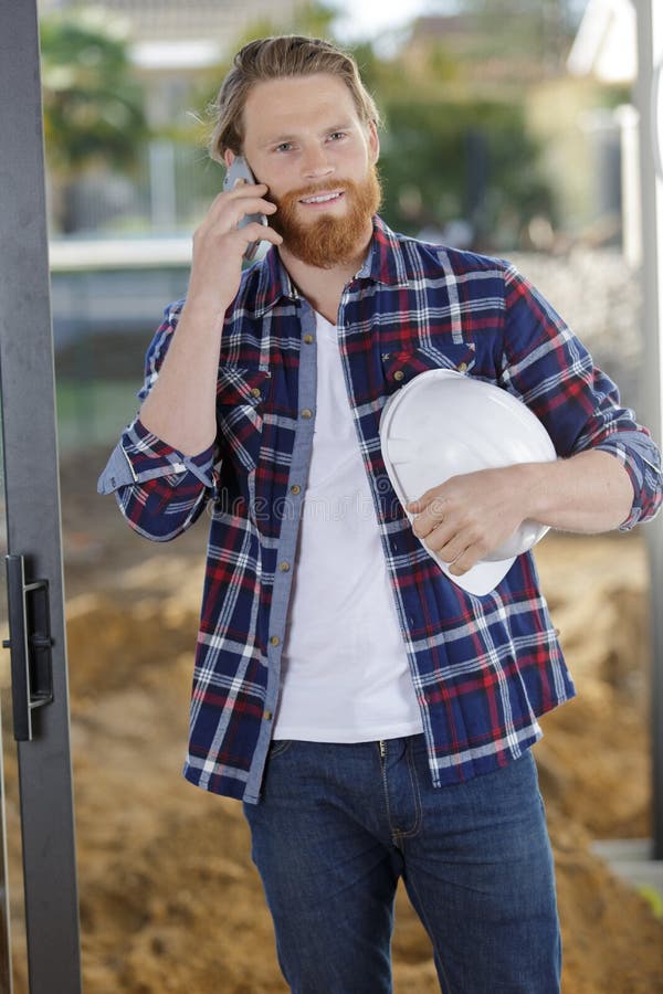 Male Builder Uses Mobile Phone Stock Photo - Image of architecture ...