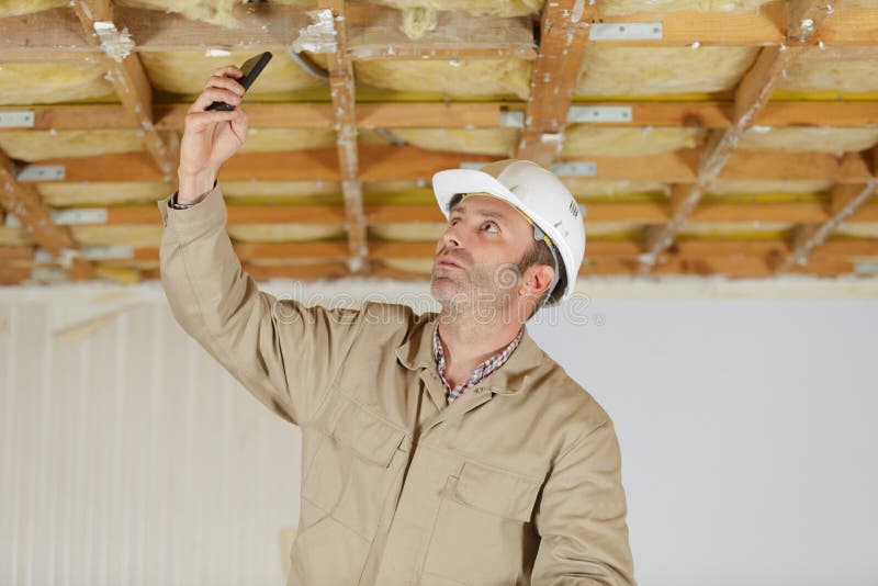 Male Builder Using Smartphone To Take Photograph on Site Stock Photo ...