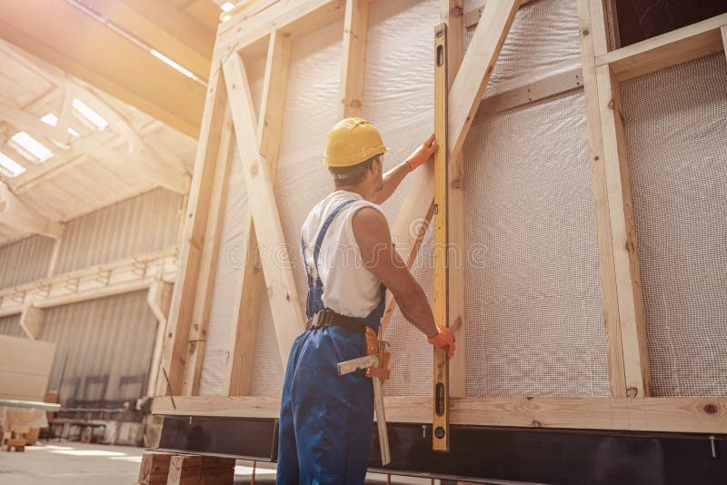 Male Builder in Work Overalls Working at Construction Site Stock Photo ...