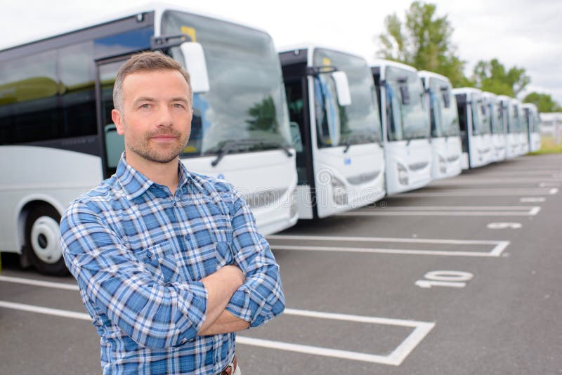 Male Bus Driver Next To Buses Stock Image - Image of road, number ...