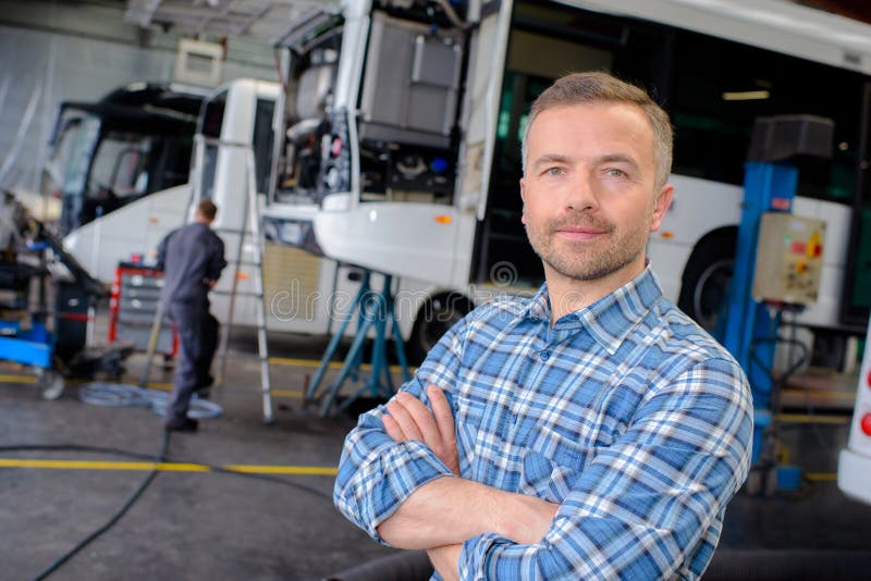 Male bus garage manager stock image. Image of factory - 186441853