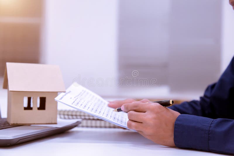 Male Business Man Reading a Document To Make a Financial Statement with ...