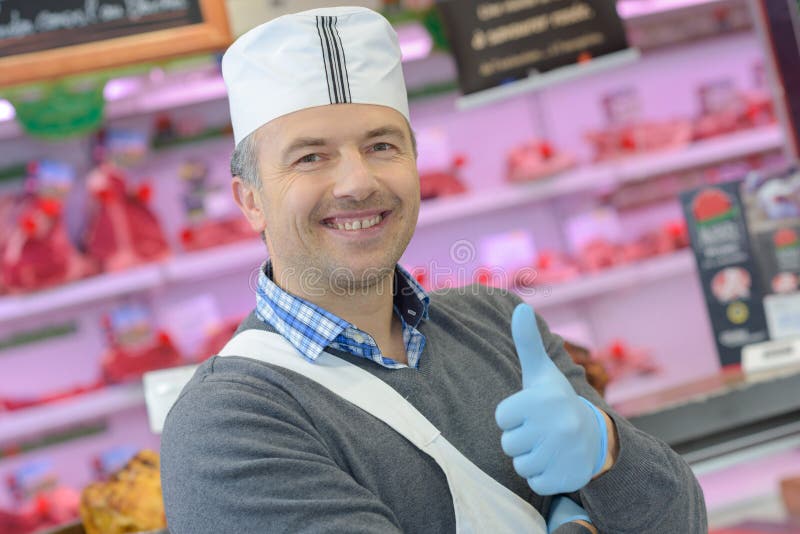 Male Butcher Holding Up Thumb Stock Photo - Image of gesturing ...