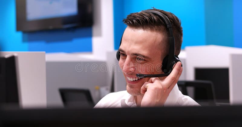 Male Call Center Operator or Telesales Agent Working on His Desk ...