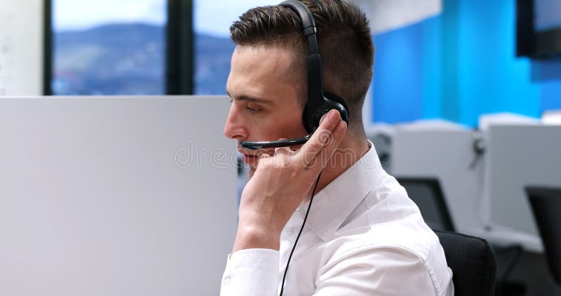 Male Call Centre Operator Doing His Job Stock Image - Image of headset ...