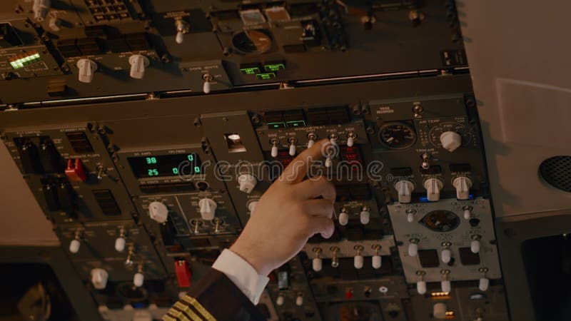 Male Captain Pushing Dashboard Buttons To Start Airplane Engine Stock ...