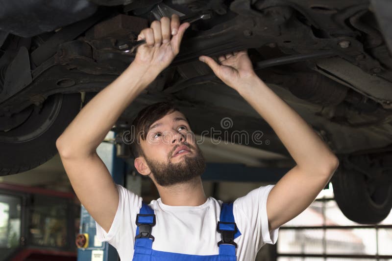 Male Car Mechanic Working Under Car Stock Photo - Image of vehicle ...