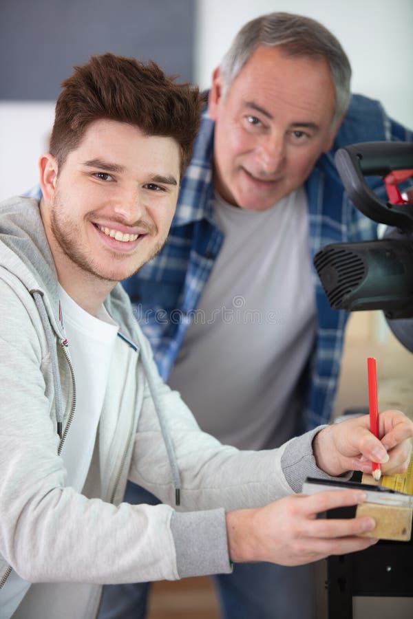 Carpenter and Apprentice in Workshop Stock Image - Image of carpentry ...