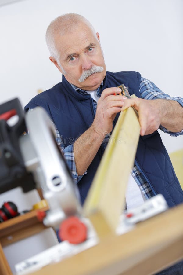 Male Carpenter Cutting Wood Stock Image - Image of circular, timber ...