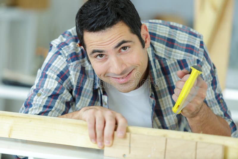 Male Carpenter Cutting Wooden Plank Stock Image - Image of blade ...