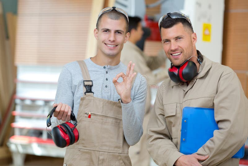 Male Carpenter Showing Perfect Sign beside Supervisor Stock Photo ...