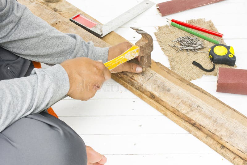Carpenter Using Chisel and Hammer in His Hand with Plank.Close Up Stock ...