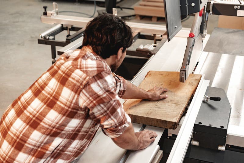 Male Carpenter Using Some Woodworking Tools for His Work in a Factory ...