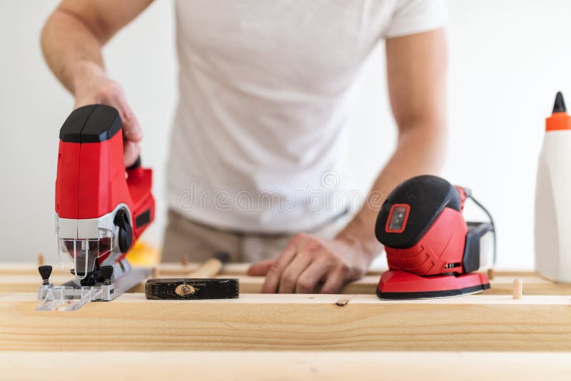 Male Carpenter Working on a Project Stock Image - Image of sawing ...