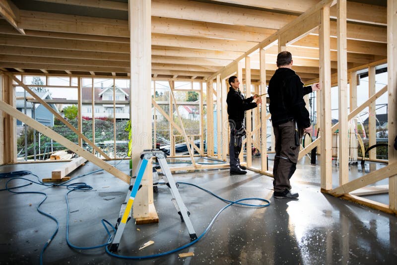 Male Carpenters Working at Construction Site Stock Image - Image of ...