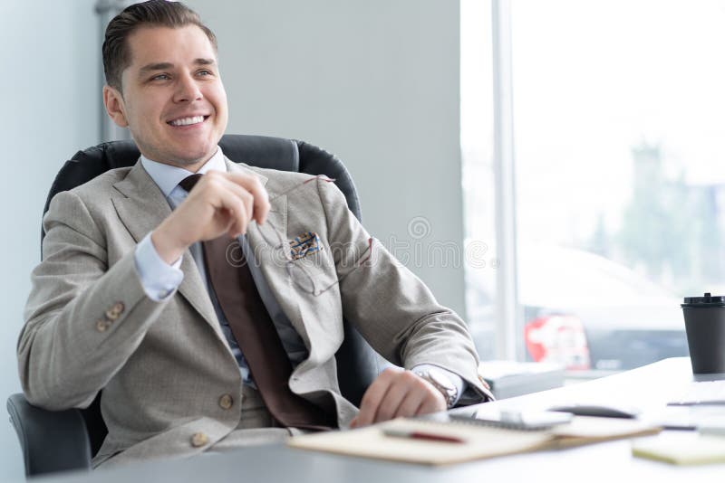 Male Casual Office Worker Smiling in Office, Sitting at Workplace ...