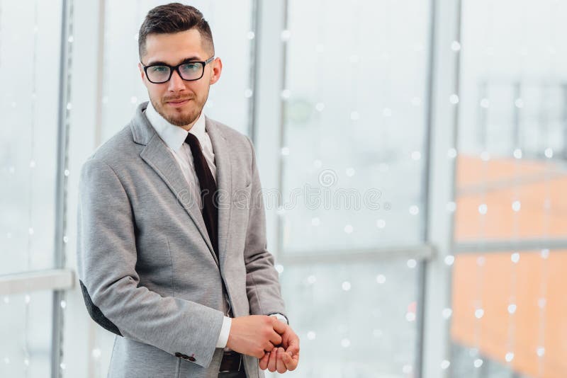 Male Casual Office Worker Smiling in Office, Standing, Looking ...