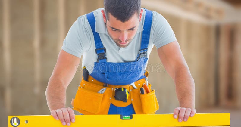 Male Caucasian Construction Worker Using Level while Working at Side ...