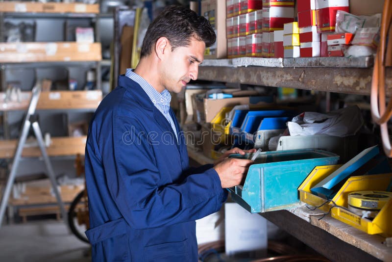 Male is Checking Small Details in Boxes Stock Image - Image of small ...