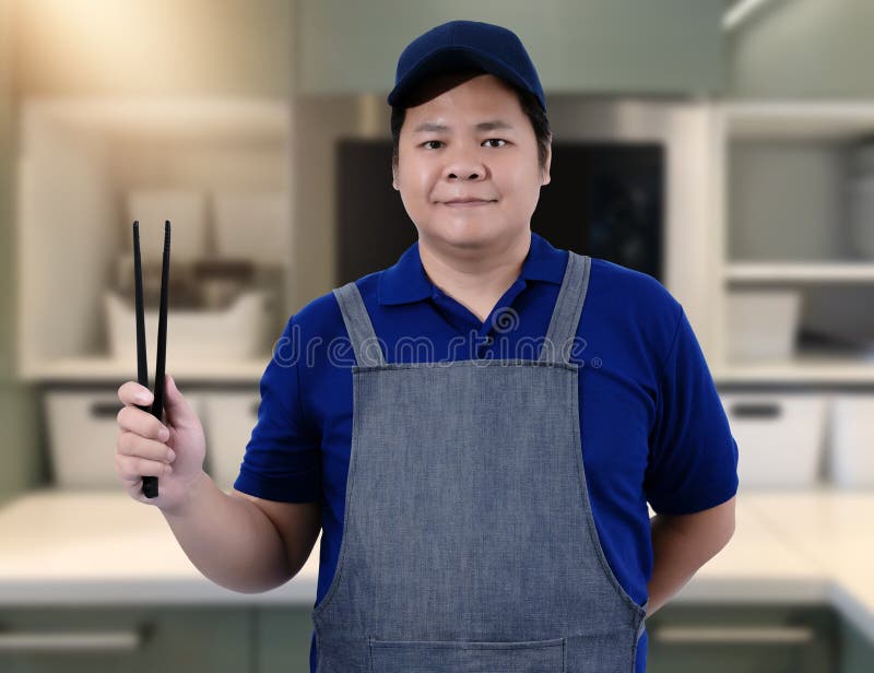 Male Chef Assistant Holding Kitchen Equipment Stock Image - Image of ...