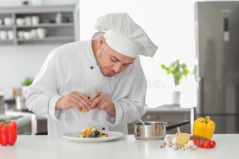 Male Chef Dressing Tasty Salad in Kitchen Stock Image - Image of ...