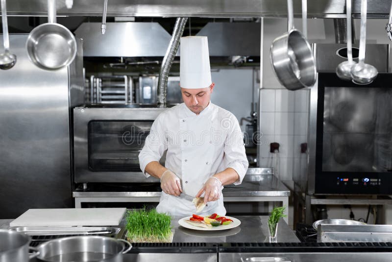 Male Chef Garnishing Food in the Kitchen. Stock Image - Image of ...