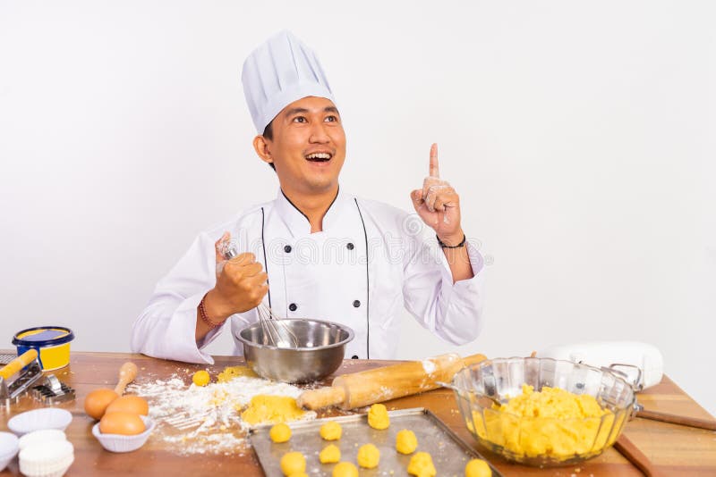 Male Chef Gesturing for Ideas Using Whisk in Mixing Bowl Stock Image ...