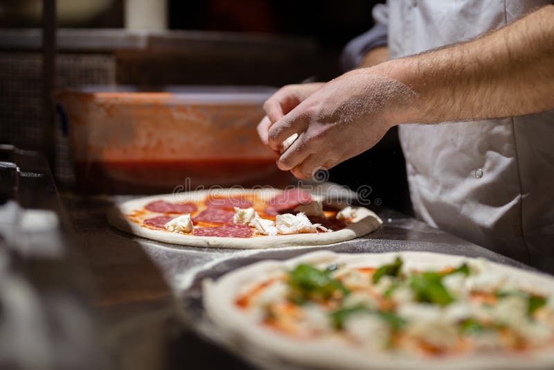 Male Chef Hands Making Pizza in the Pizzeria Kitchen Stock Image ...