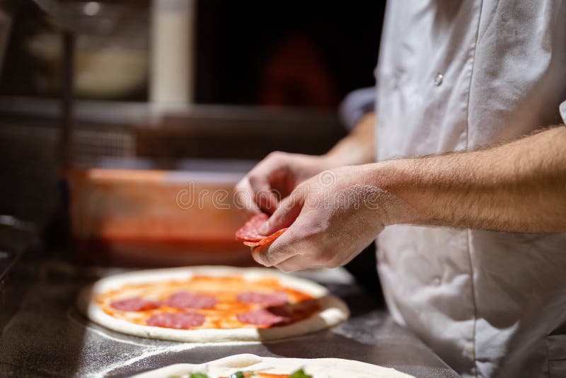 Male Chef Hands Making Pizza in the Pizzeria Kitchen Stock Photo ...